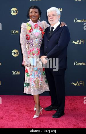 Mellody Hobson, left, and George Lucas attend the premiere of "Wicked ...