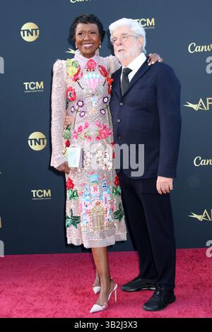 Mellody Hobson, left, and George Lucas attend the premiere of "Wicked ...
