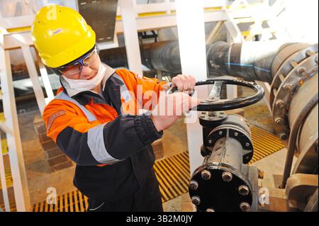 Workers fix and prepare layers of cathode copper at the plant Stock ...