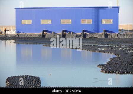 The chemical tank is covered with plastic balls to slow evaporation at ...