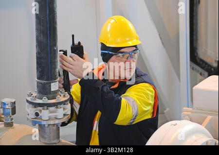 Workers fix and prepare layers of cathode copper at the plant Stock ...