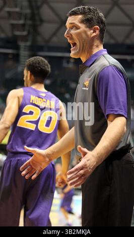 New Iowa head coach Ben McCollum walks onto the court before an NCAA ...