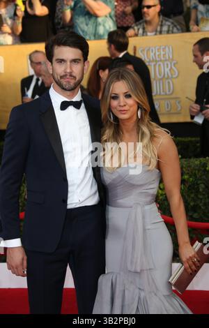 Tennis player Ryan Sweeting (L) and actress Kaley Cuoco arrive for the ...