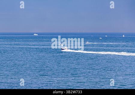 boats off montauk point with off shore wind farm in the distance Stock ...
