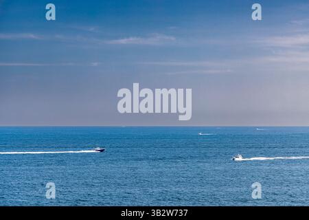 boats off montauk point with off shore wind farm in the distance Stock ...