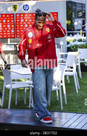 Ferrari driver Lewis Hamilton of Great Britain, right, drives during a ...