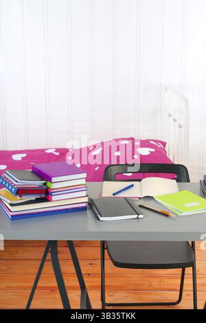 Making homework in bedroom Stock Photo - Alamy