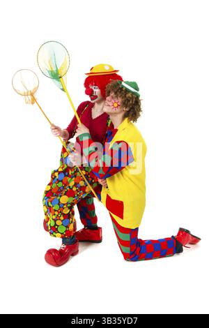 Couple funny full dressed clowns are catching it all Stock Photo - Alamy