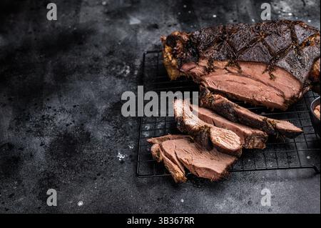 Roasted Roe Deer leg. slow cooked game meat of venison with bone ...