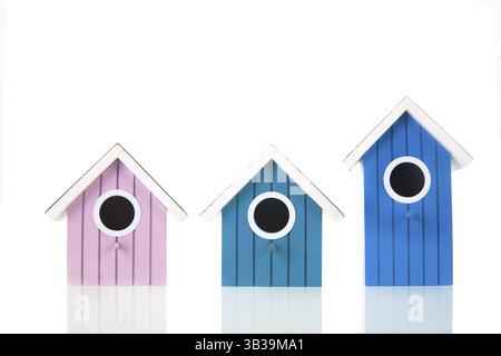 Many colorful bird boxes isolated over white background Stock Photo - Alamy