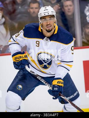 Vancouver Canucks left wing Evander Kane (91) moves the puck ahead of Tampa Bay Lightning ...