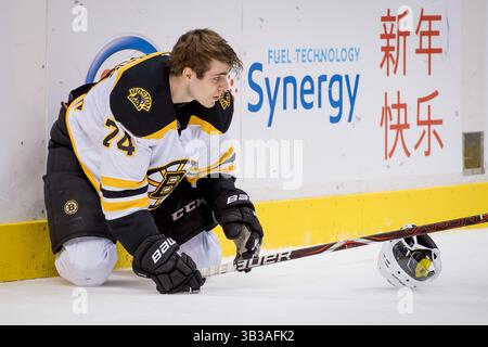 Vancouver Canucks' Jake DeBrusk (74) moves the puck against the ...