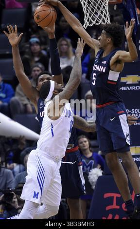 Connecticut's Isaiah Whaley (5) blocks a shot attempt by Memphis ...
