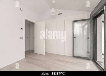 Built-in closets, which blend seamlessly into the wall, are an ...