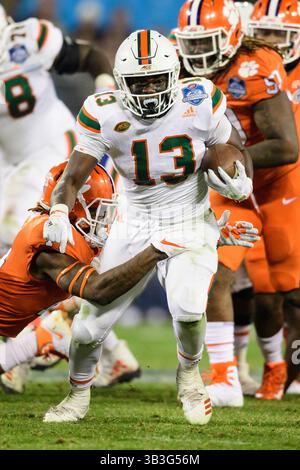 Miami running back Deejay Dallas runs a drill at the NFL football scouting combine in ...
