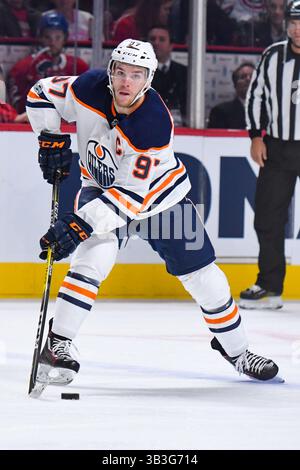 Edmonton Oilers' Connor McDavid controls the puck during an NHL hockey ...