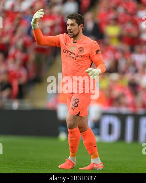 Nottingham Forest goalkeeper Stefan Ortega punches the ball clear ...