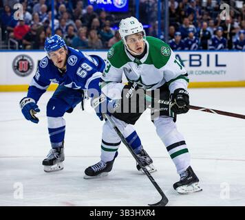 Tampa Bay Lightning center Jake Guentzel (59) controls the puck on an ...