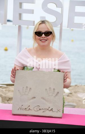 Nicola Coughlan shows off her handprints in cement during the "Prix ...