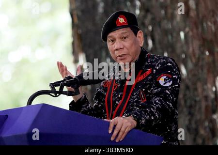 Philippine President Rodrigo Duterte wearing military uniform addresses ...