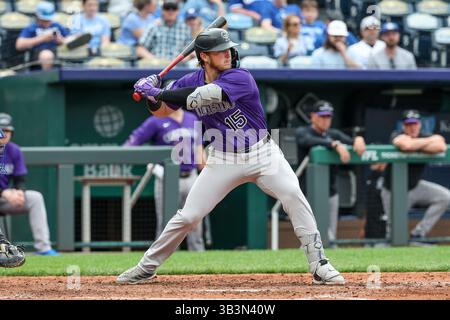 Colorado Rockies' Hunter Goodman (15) follows through on hitting a ...