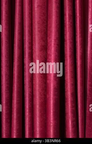 Cinema movie theatre with red velvet seats and a blank white screen ...