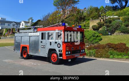 Classic Bedford Mountain Fire Engine - truck being driven along road ...