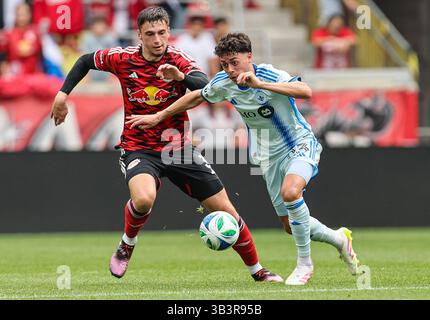 CF Montreal midfielder Caden Clark, center, tries to move the ball ...