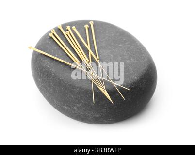 Acupuncture needles and spa stone on water, closeup Stock Photo - Alamy