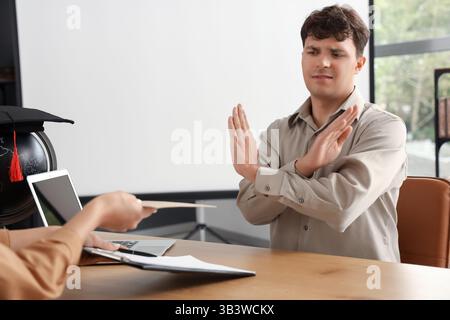 Male teacher refusing to take bribe in classroom. Corruption concept ...