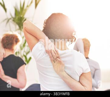 Group Of Fit People Doing Stretching Exercise On White Background Stock ...