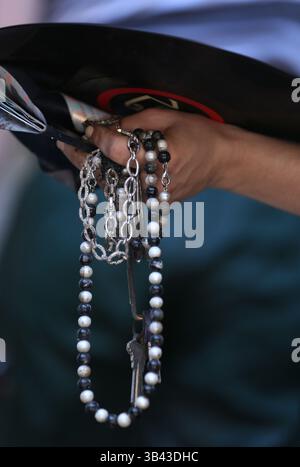 Dayleen Marrero holds a few pieces of jewelry and a Led Zeppelin record ...
