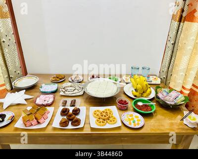 Sinhala and Tamil New Year celebration table with traditional sweets ...