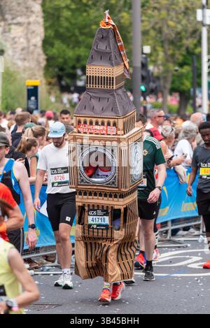 Marathon runners passing Big Ben during the London Marathon. London, UK ...