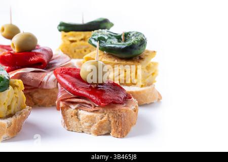 Traditional Spanish pintxos isolated on white background Stock Photo ...