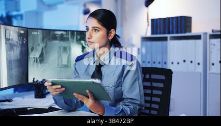 Businesswoman Watching CCTV Footage On Laptop Stock Photo - Alamy