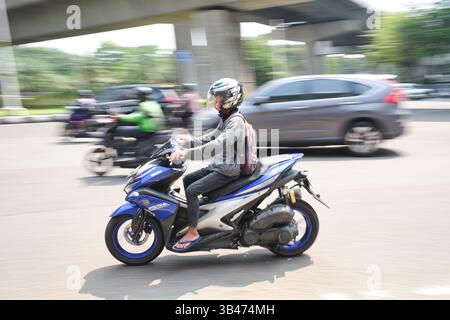 Fast moving Motorcycles or Bikers while background is in motion blur on ...