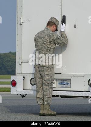 A member of the military bows his head during a commemoration service ...