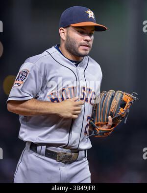 Houston Astros' Jose Altuve heads to first base after drawing a walk ...