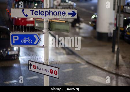signage and bus stops at train station Stock Photo - Alamy
