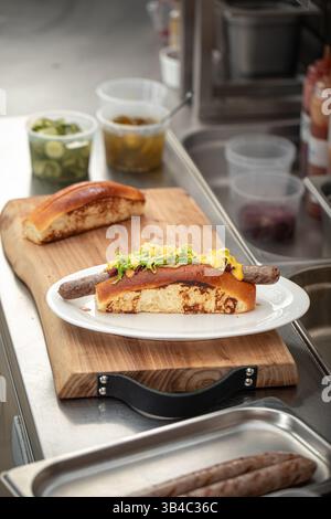 Preparing hot dogs in diner kitchen counter Stock Photo - Alamy