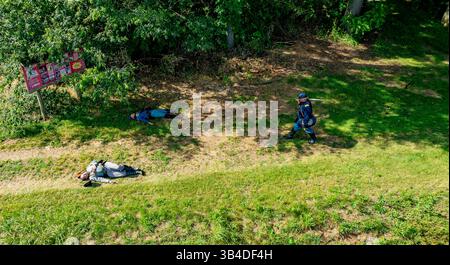 Law enforcement search a wooded area outside campus a day after the ...