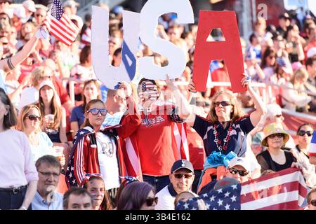 Fans of Canada and China cheer during the match between Victoria Mboko ...