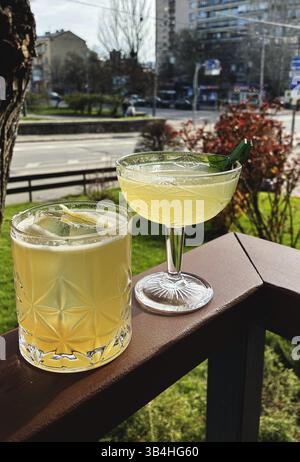 Refreshing summer cocktails on a garden table. Close up photo of ...
