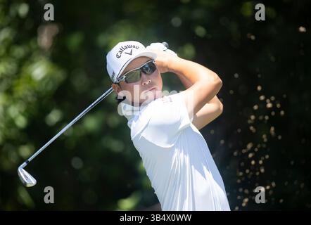 Min Woo Lee of Australia plays a shot in round one of the Australian ...