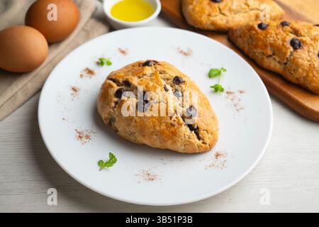 Triangular English scones with dark chocolate chips. Top view table ...