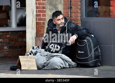 Homeless man begging on High Street, Alton, Hampshire, UK Stock Photo ...