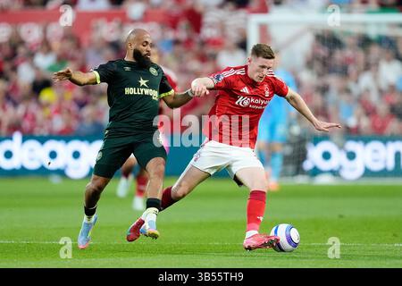 Elliot Anderson of Nottingham Forest and Bryan Mbeumo of Manchester ...