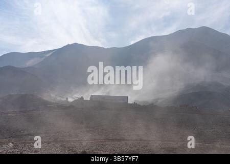 Dust filling the air at an open pit mine site near Copiapo in the ...