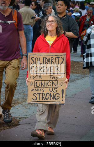 May Day demonstration supporting workers' rights and against the Trump ...